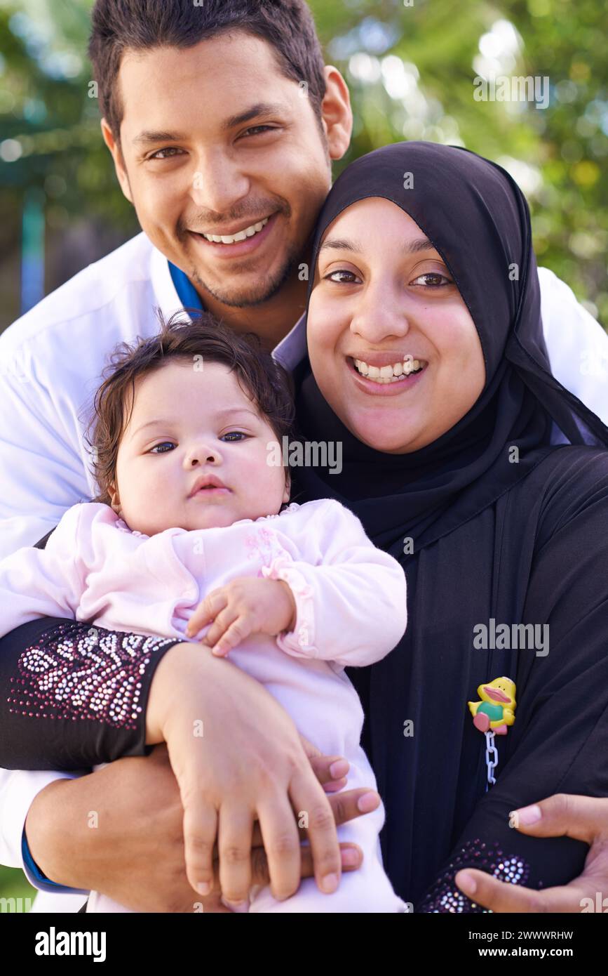 Muslim, park and portrait of parents with baby for bonding, ramadan and ...