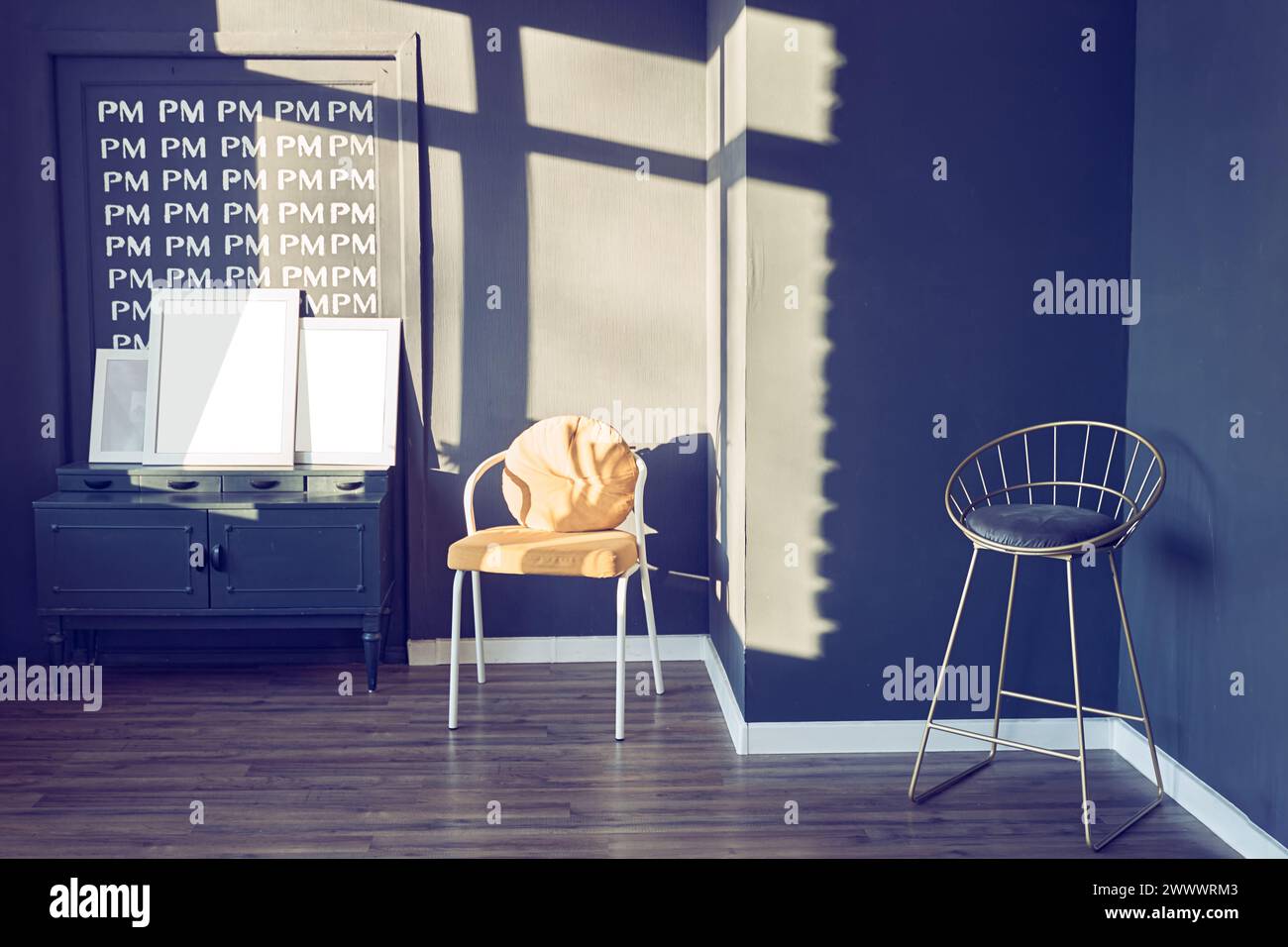 Interior design of blue room with modern chairs, photo frames, with TV ...