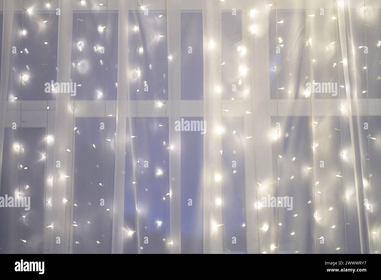 Led light wall garlands, string lights on white tulle fabric backdrop ...