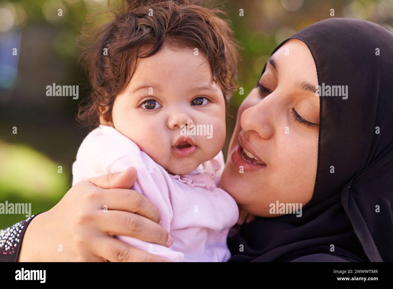 Muslim woman, mother and baby with hug for love, care and bonding ...