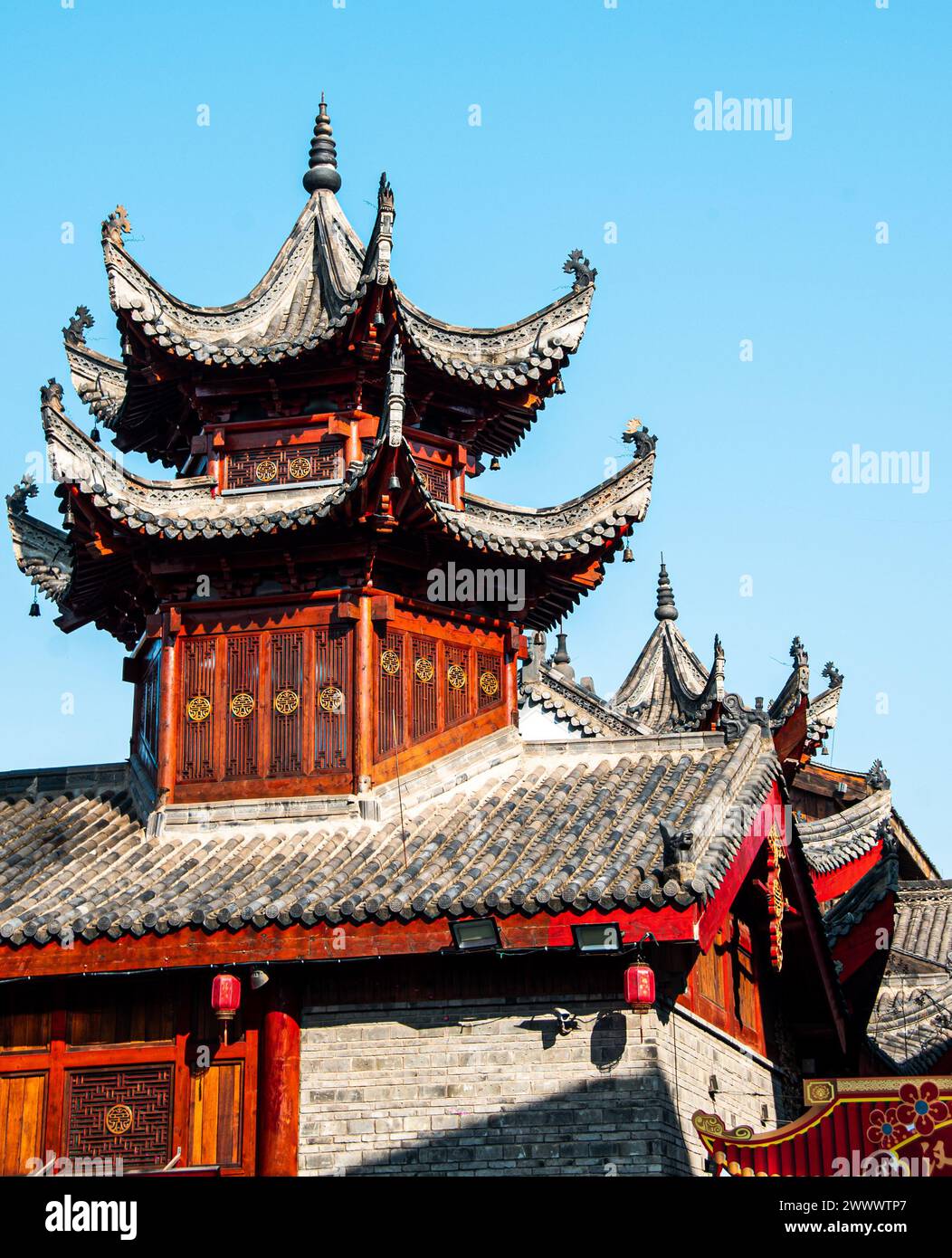 The traditional Chinese brick and wood architecture under sunlight in ...