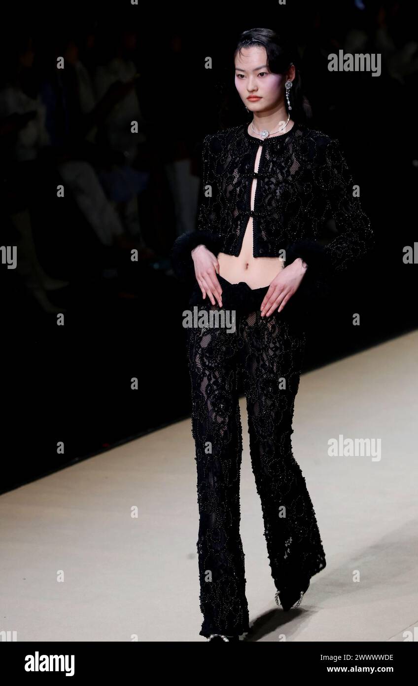 Shanghai. 25th Mar, 2024. A model presents a creation of Le Fame during ...