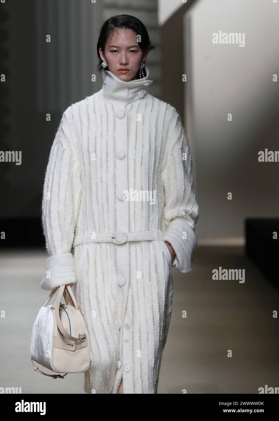 Shanghai. 25th Mar, 2024. A model presents a creation of Le Fame during ...