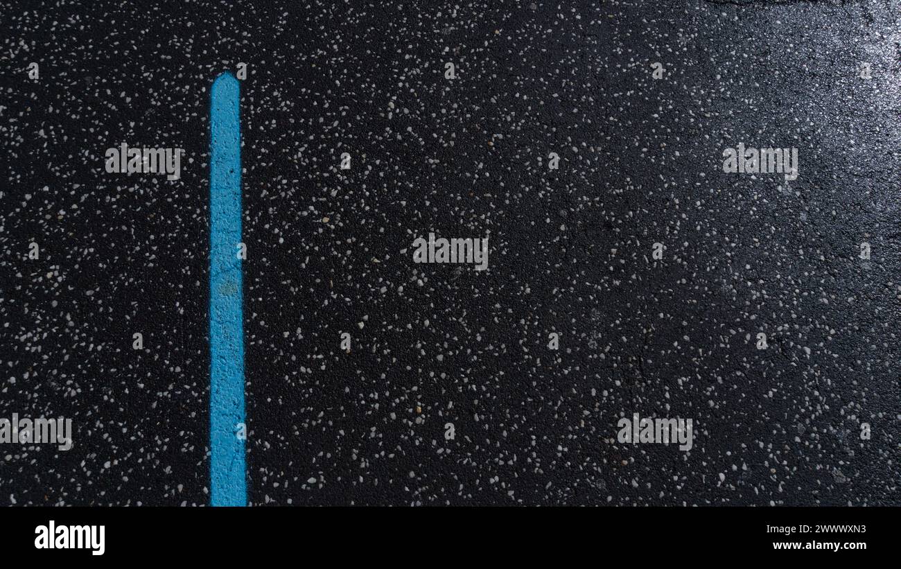 Vibrant blue line, textured urban road Stock Photo - Alamy