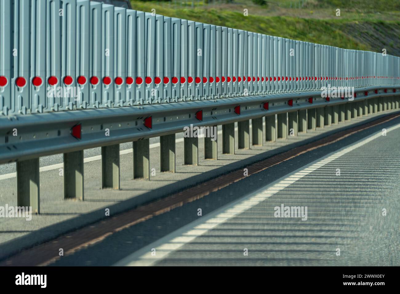 Safety barriers on highway. Anodized safety steel barrier. Enhancing ...