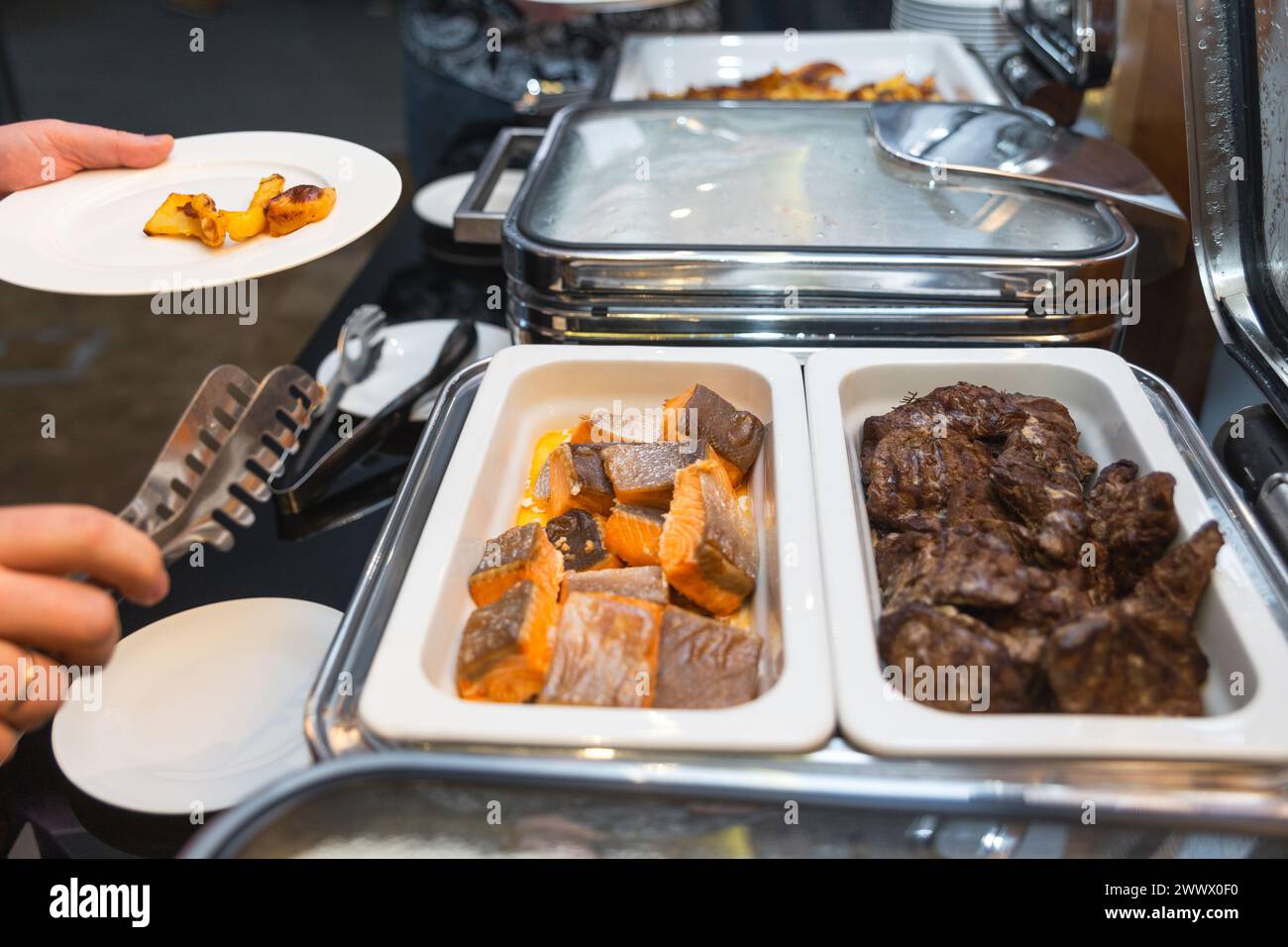 The participants of the business seminar choose food during their lunch ...