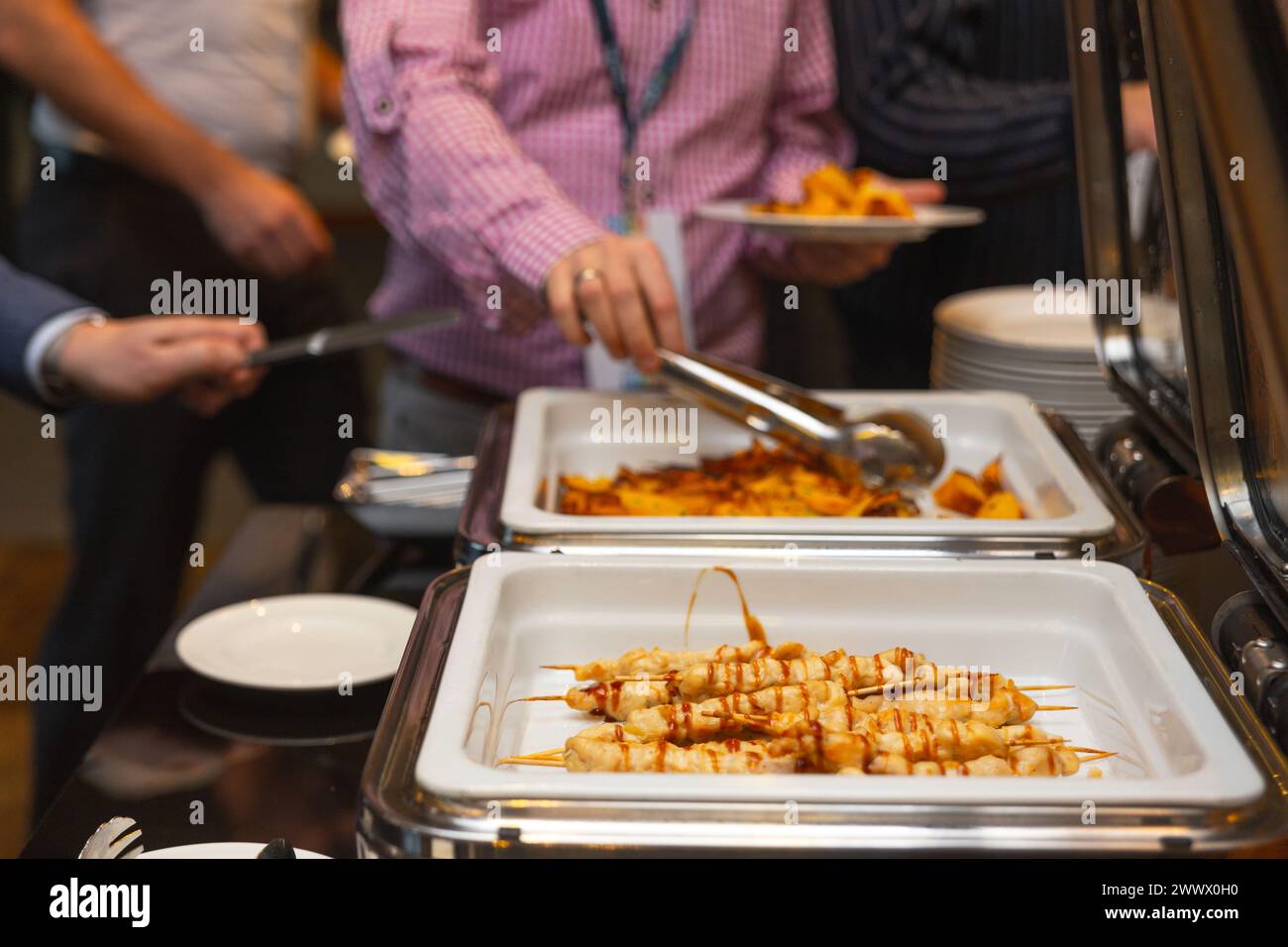 The participants of the business seminar choose food during their lunch ...