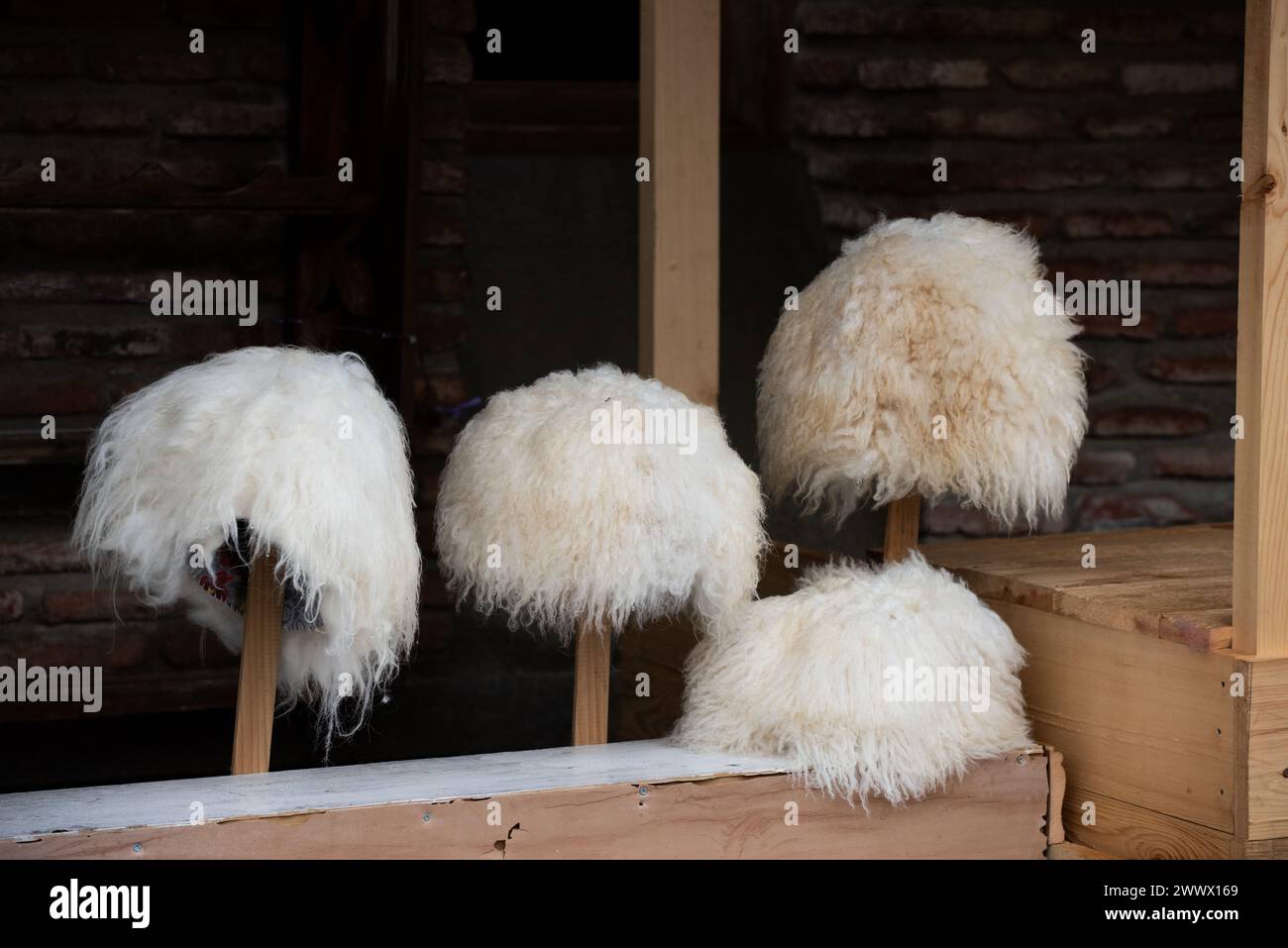 Traditional, ethnic, white, sheepskin papakha hat worn in the region of ...