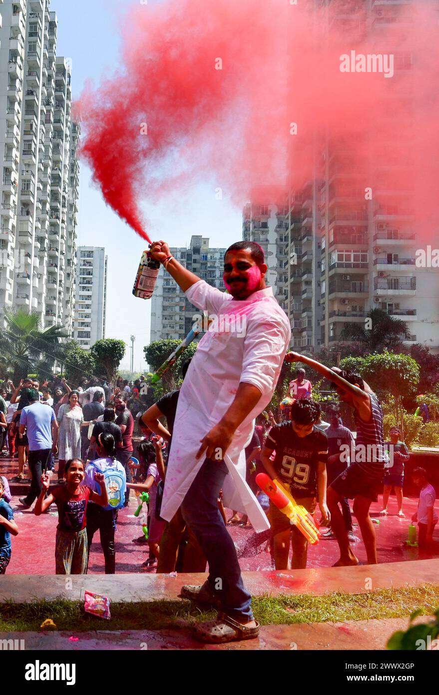 NOIDA, INDIA - MARCH 25: People celebrate Holi at Sector 121, on March ...