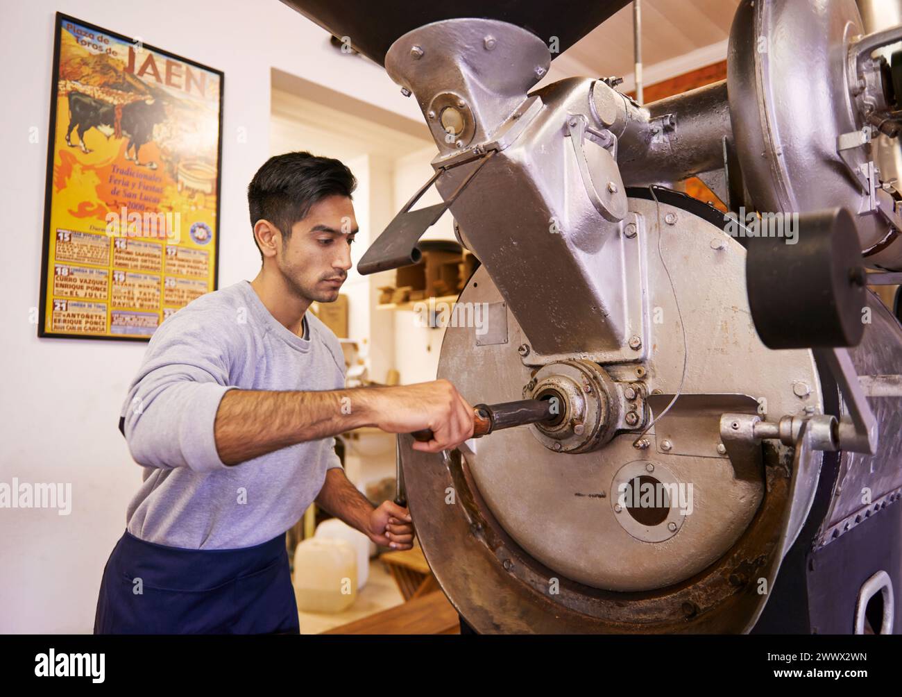 Young man working plant grinding hi-res stock photography and images ...
