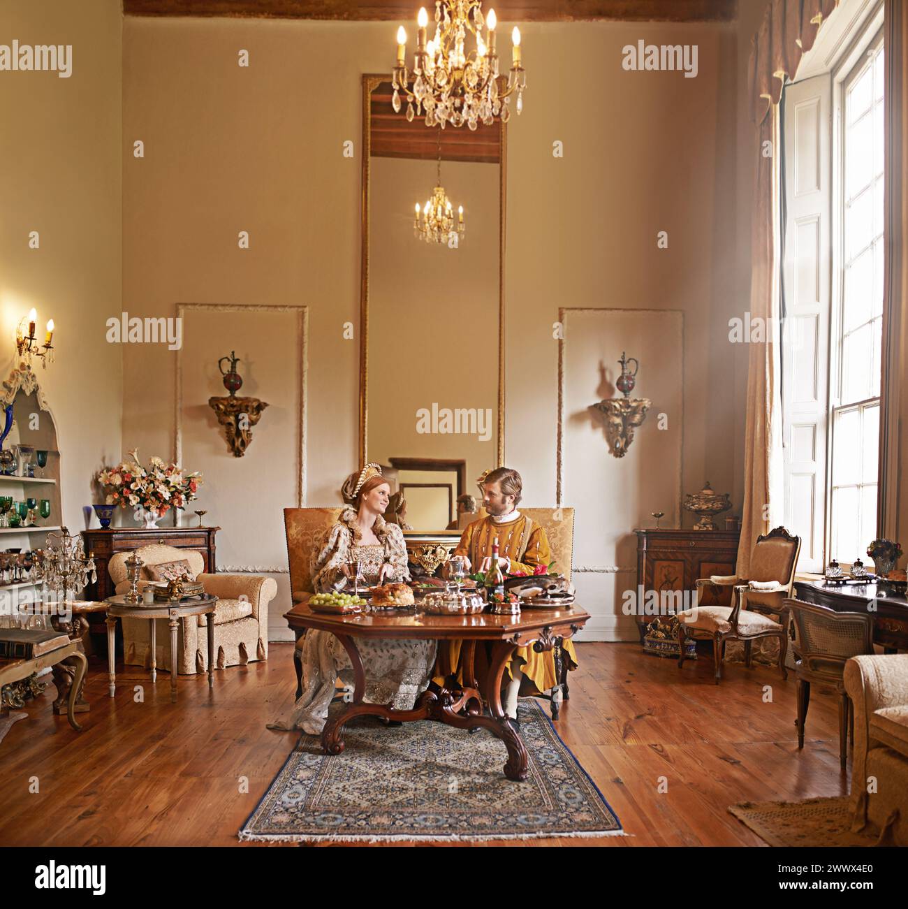 Noble, couple and wealth with food, dinner and renaissance home or ...