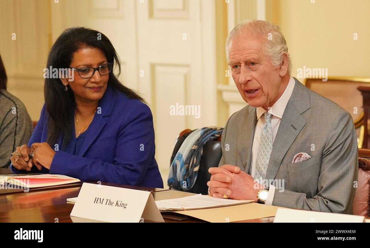 Britain's King Charles III, right, speaks during an audience in the ...