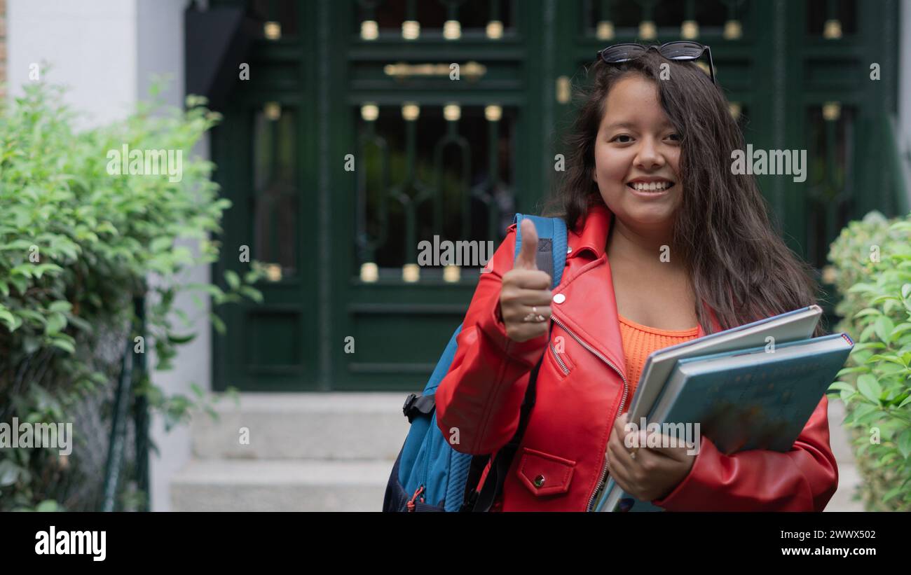 happy young student showing thumbs up as a sign of All good Stock Photo ...