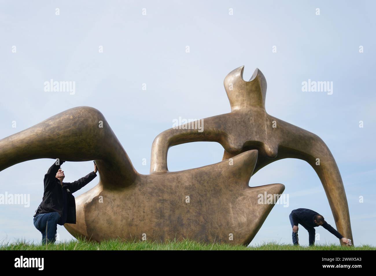 Art technicians Matthias Kessemeier and Dai Roberts clean the bronze ...