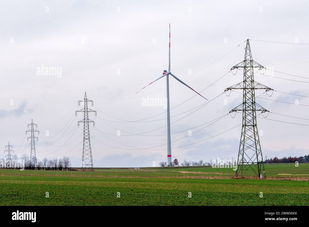 High-voltage Pylons And Wind Turbine Stock Photo - Alamy