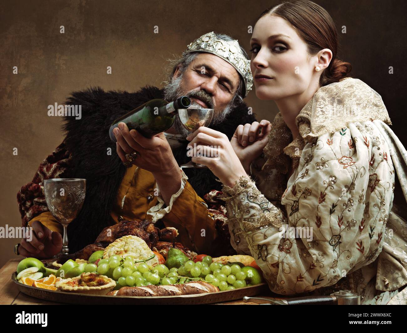 King, queen and portrait with wine at table for fine dinning in royal ...