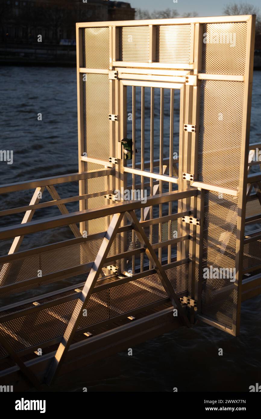A boat ramp with attached railings by the water's edge Stock Photo - Alamy