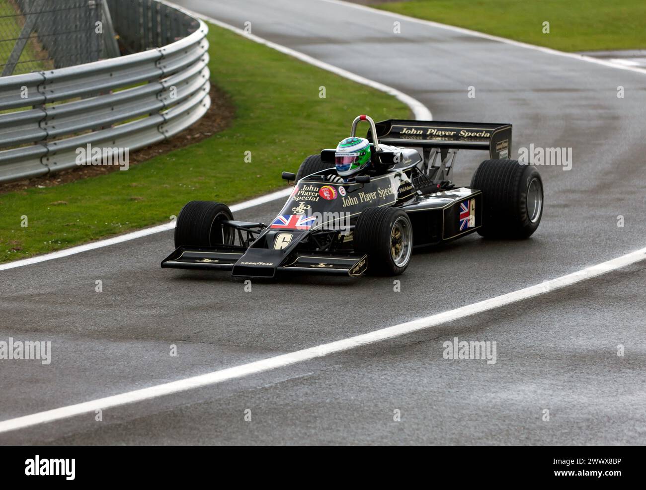 Nick Padmore bringing his Black and Gold, 1976, Lotus 77, back to the ...