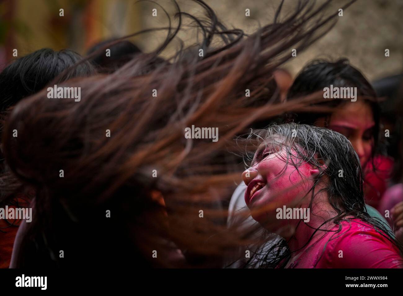 Indian women play with colored powder during celebrations marking Holi ...