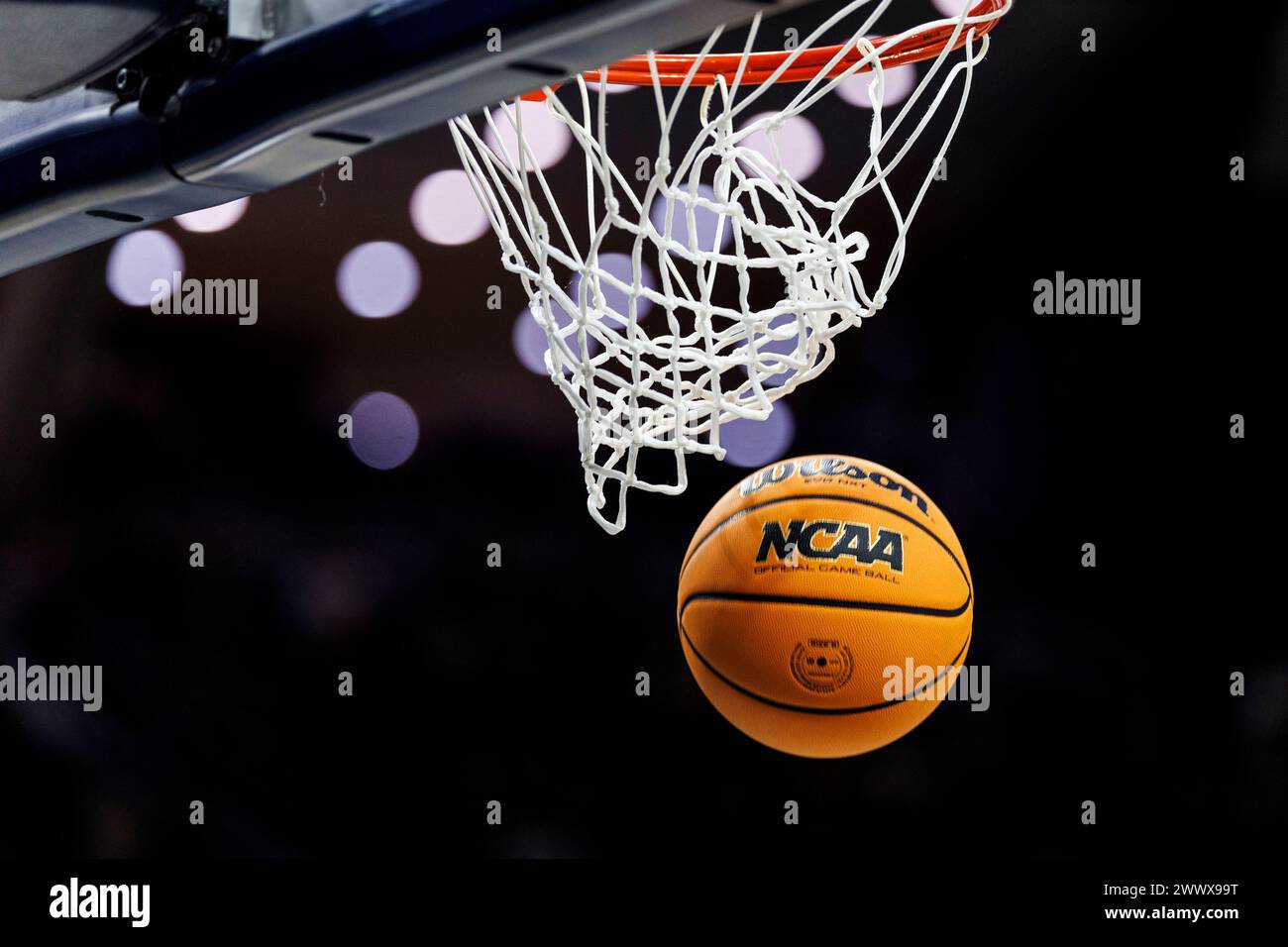 March 25, 2024: A general view of basketball with NCAA logo in net ...