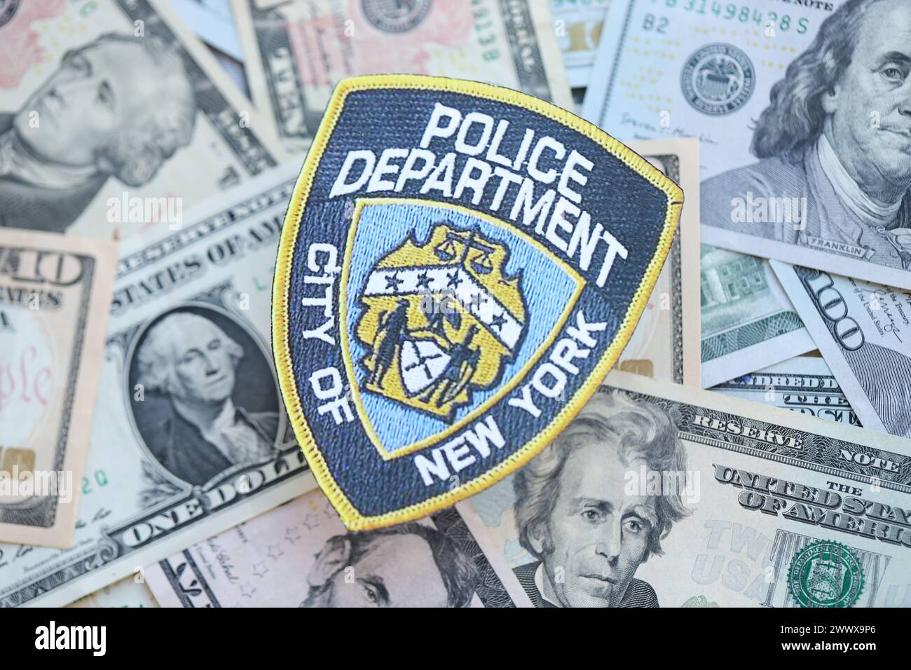 KYIV, UKRAINE - MARCH 9, 2024 US NYPD Police patch on many US dollar ...