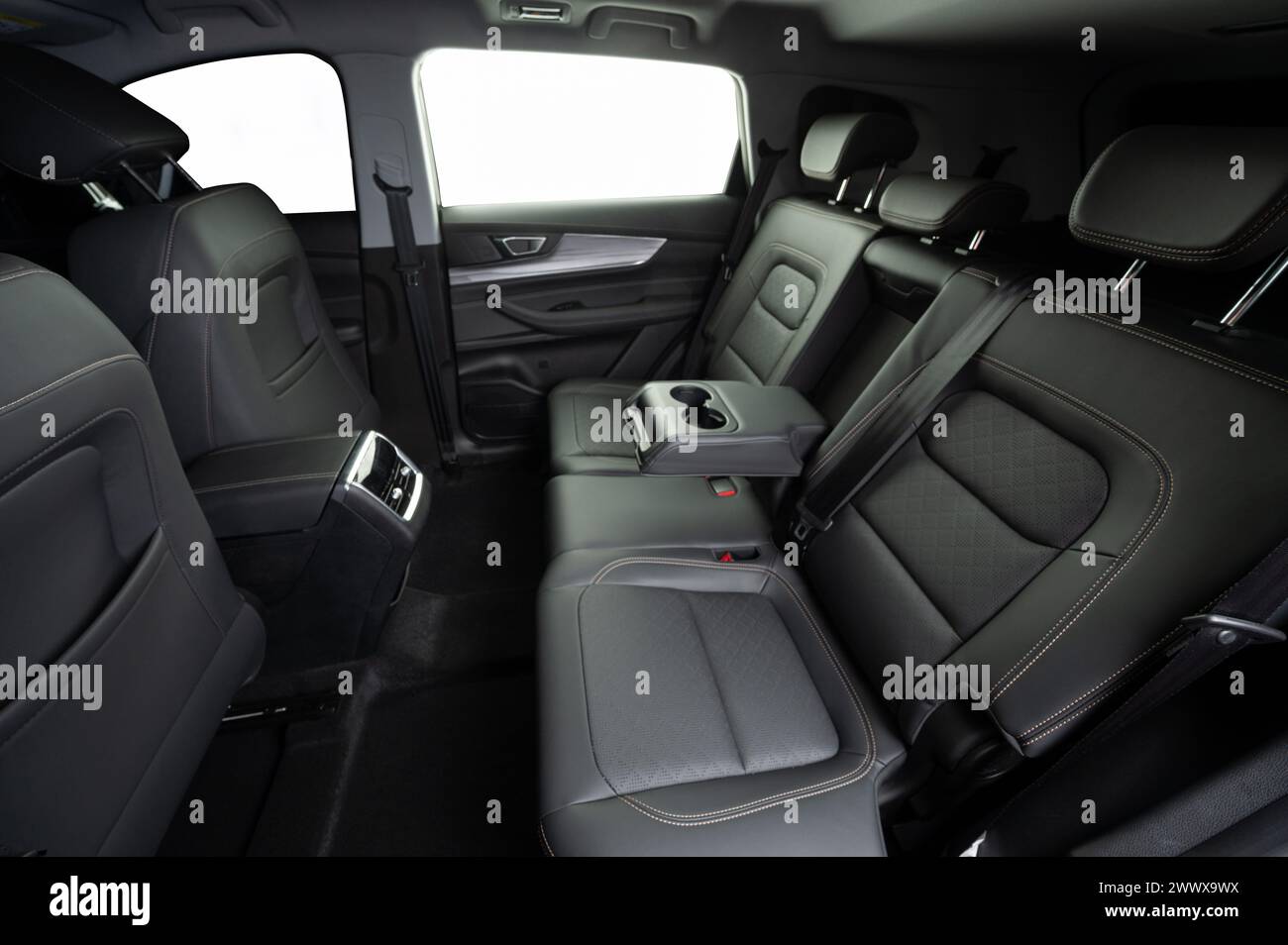 Clean perforated leather rear car seats side view with isolated windows ...