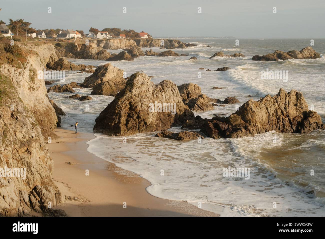The coastal rocks along a sandy shoreline. Batz Sur Mer Stock Photo - Alamy
