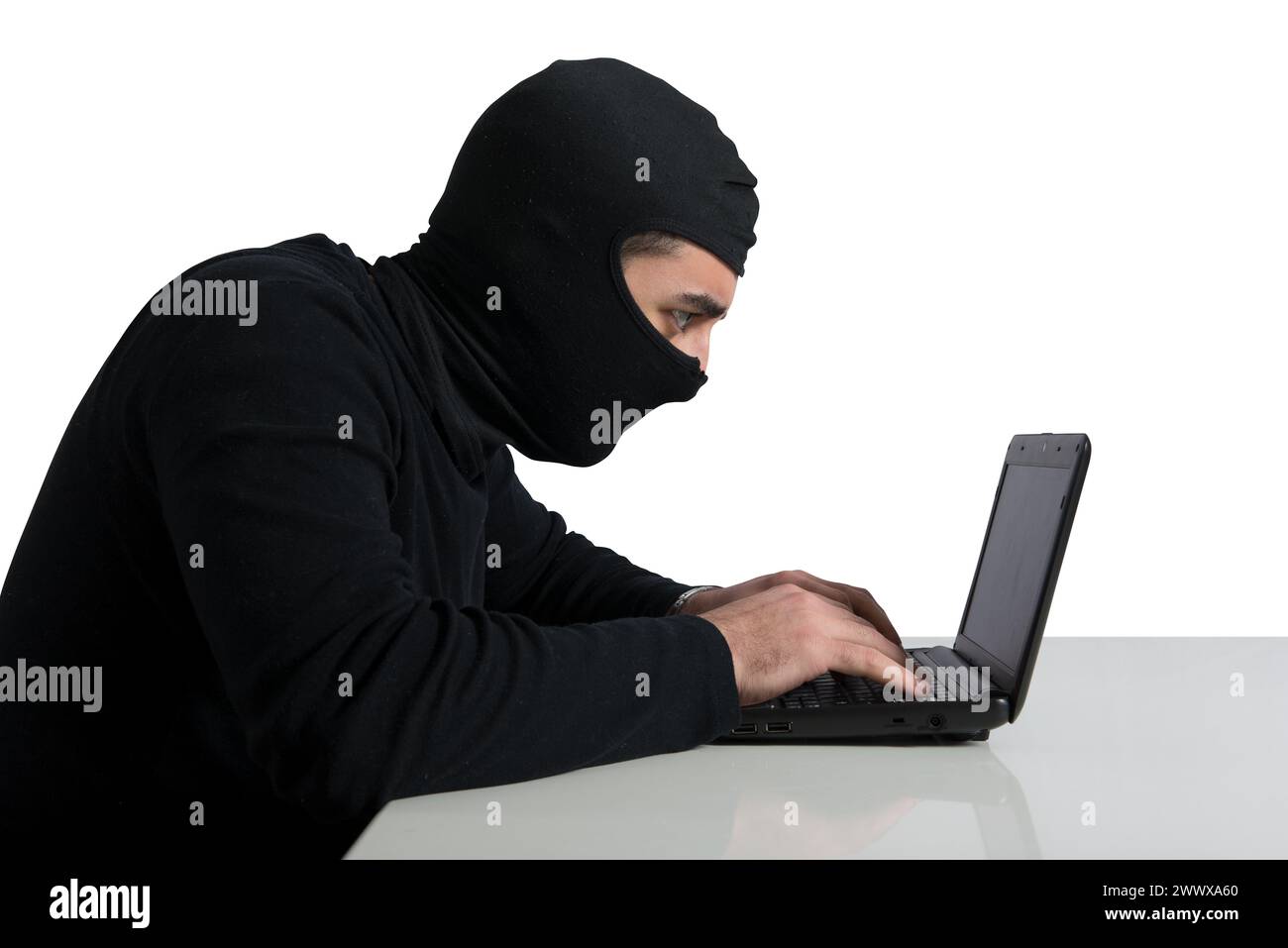 Hidden hacker works in the dark to steal data online Stock Photo - Alamy