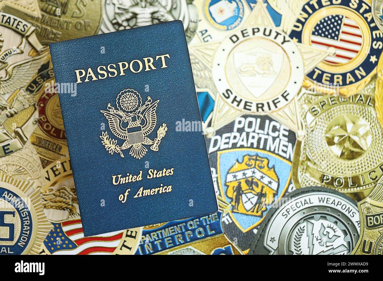 KYIV, UKRAINE - MARCH 9, 2024 US Passport lies on badges of different ...