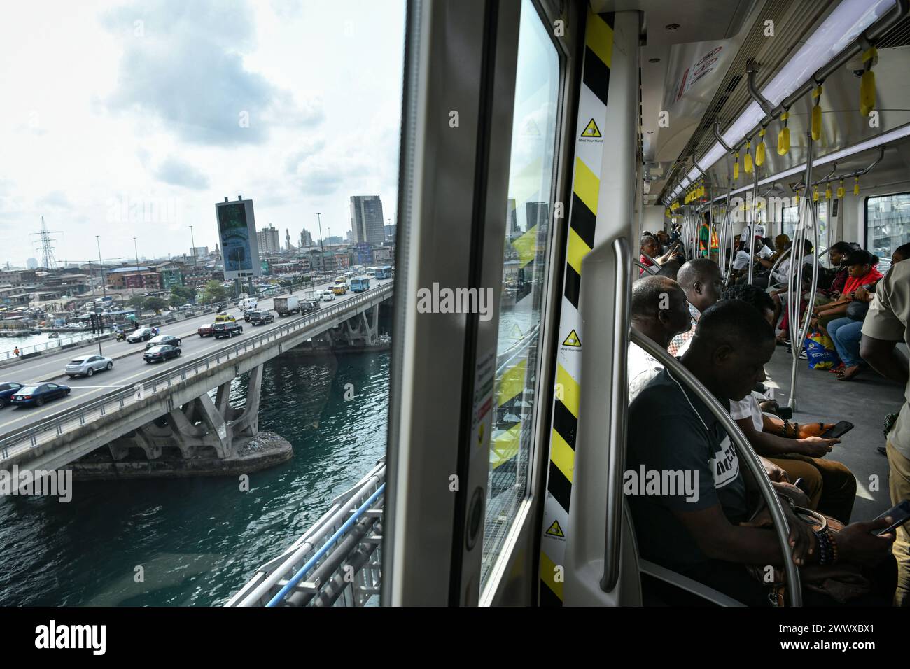 (240326) -- LAGOS, March 26, 2024 (Xinhua) -- People take a train of the Lagos Rail Mass Transit ...
