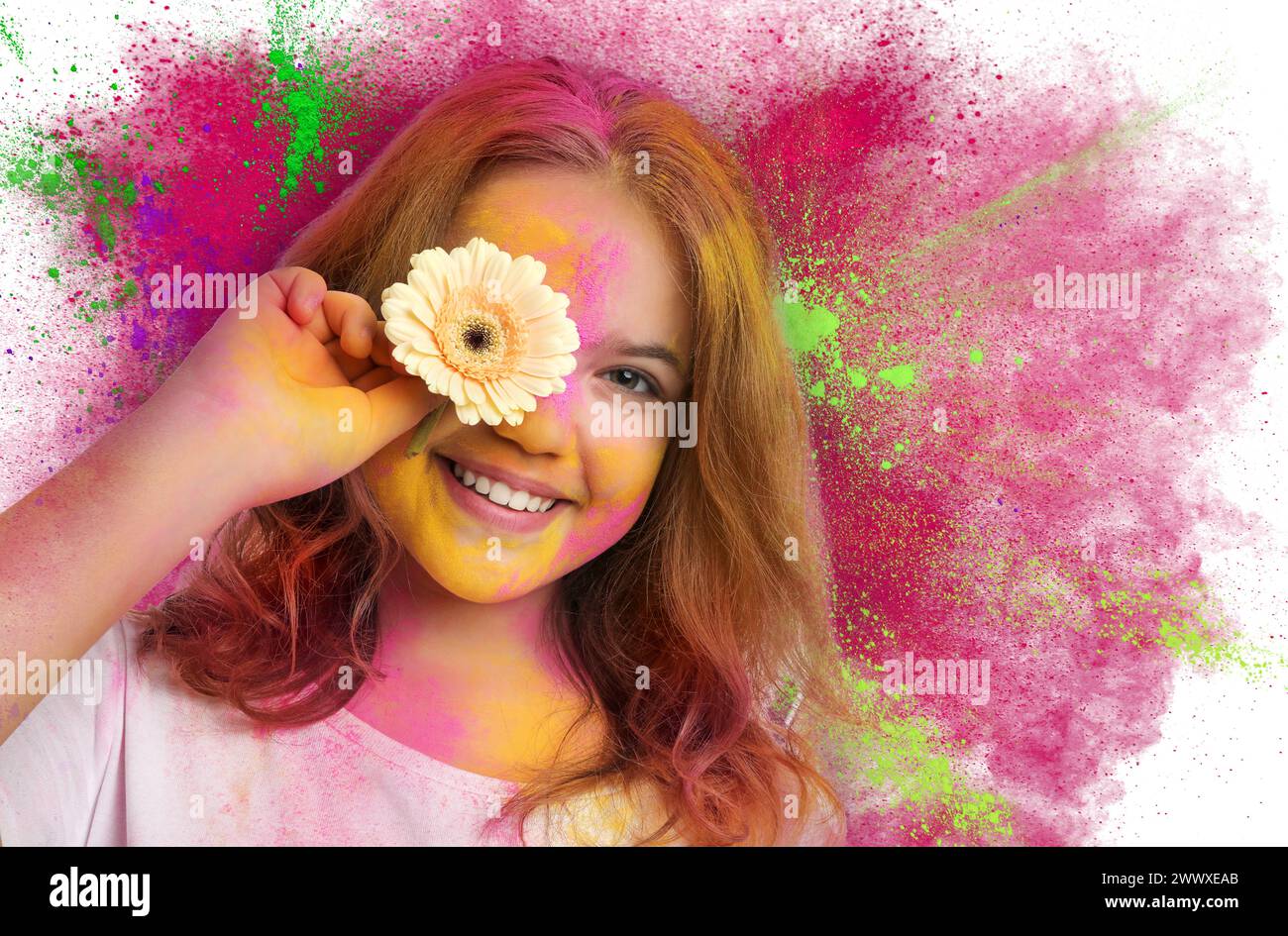 Holi festival celebration. Happy teen girl covered with colorful powder ...