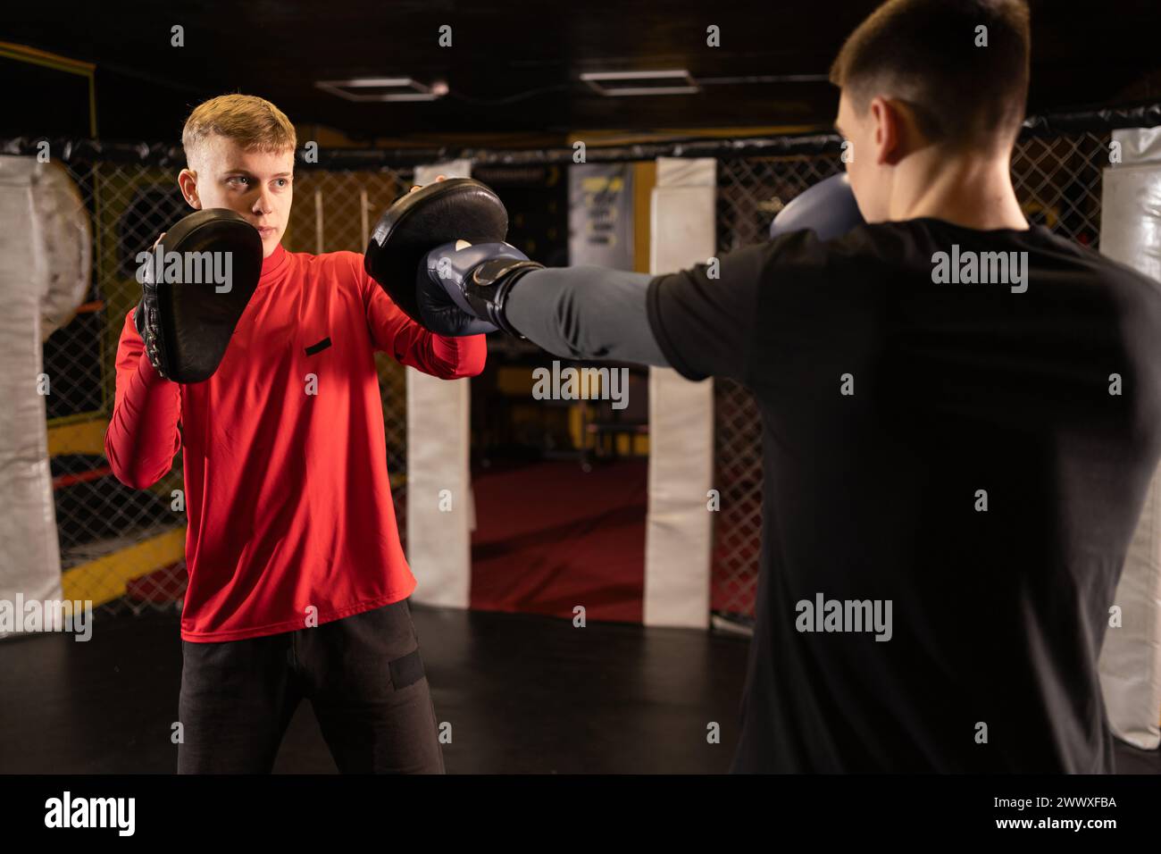 Young boxer training with his trainer during trains Stock Photo - Alamy