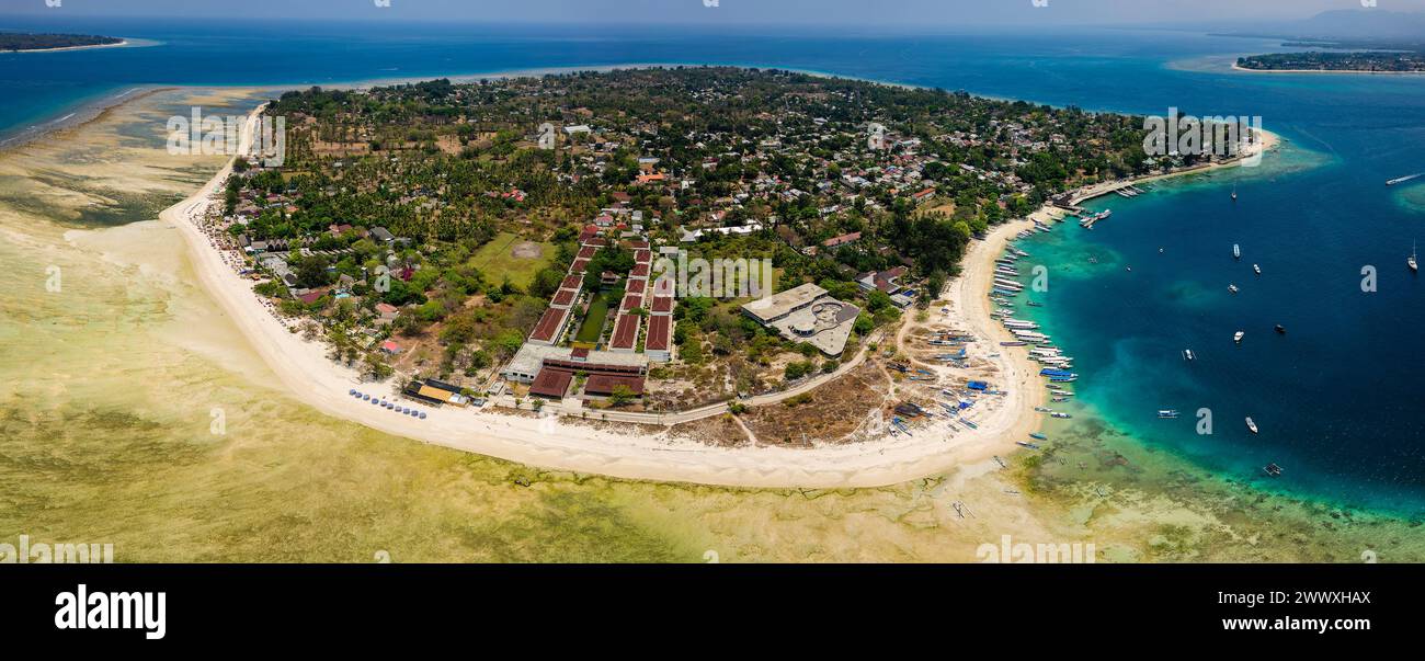 Aerial view of a large reef flat (table) of a fringing coral reef in ...