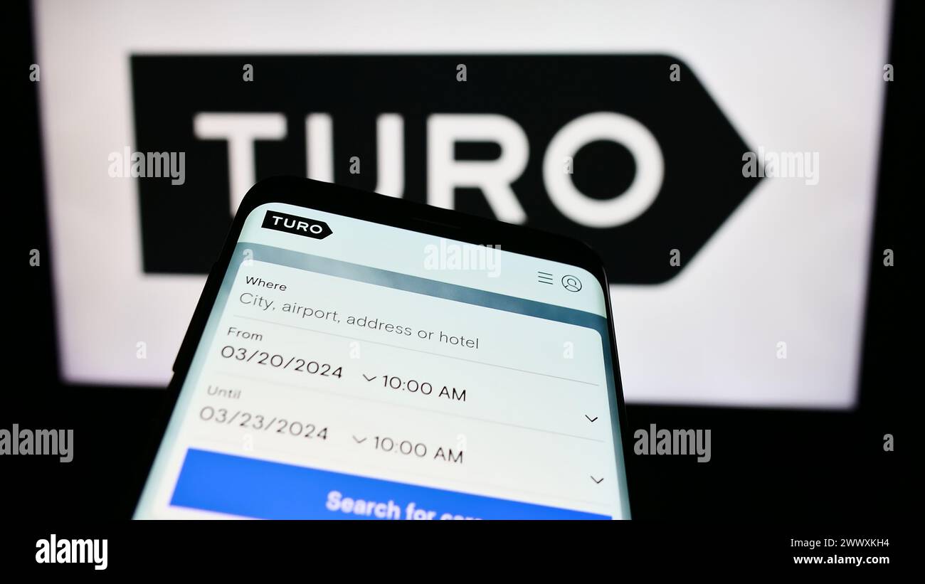 Mobile phone with website of US peer-to-peer carsharing company Turo ...