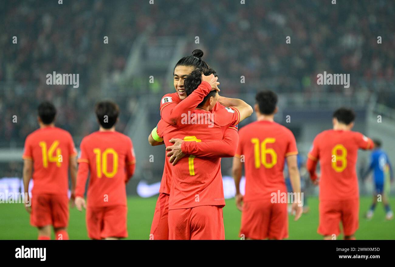 Tianjin. 26th Mar, 2024. Wu Lei (Front R) of China celebrates scoring ...