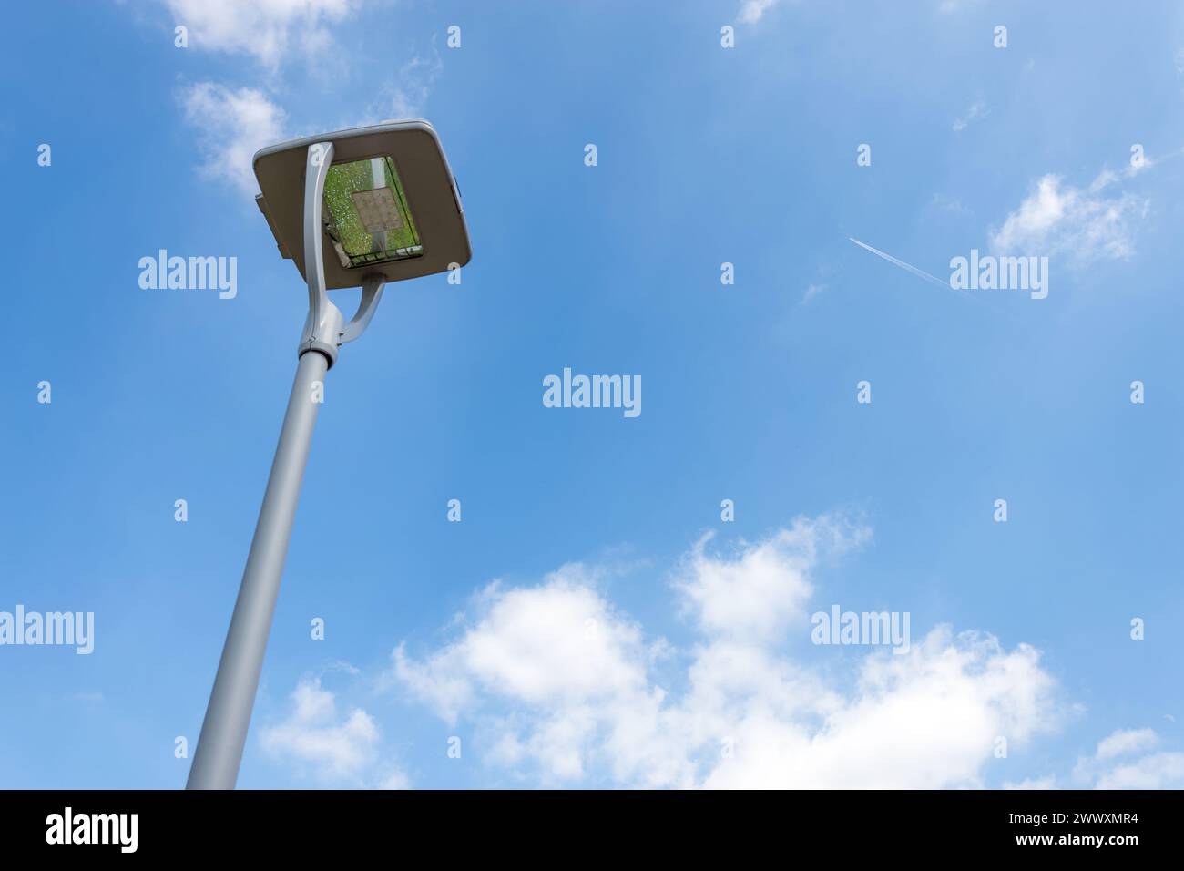 Led street lamp post isolated on blue sky background. Led lights saving ...