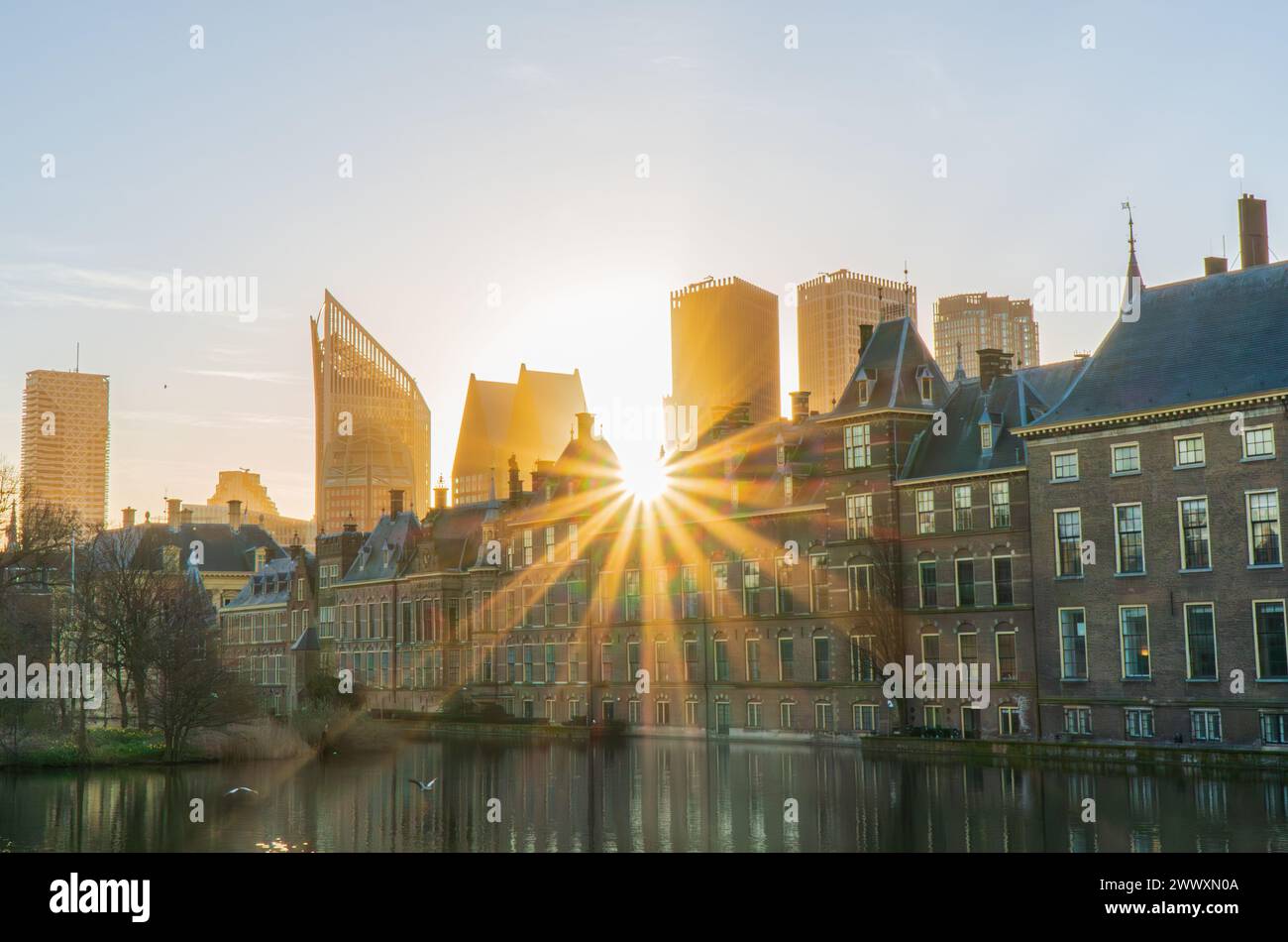 Sun rays piercing through the Binnenhof Castle, Mauritshuis museum and ...