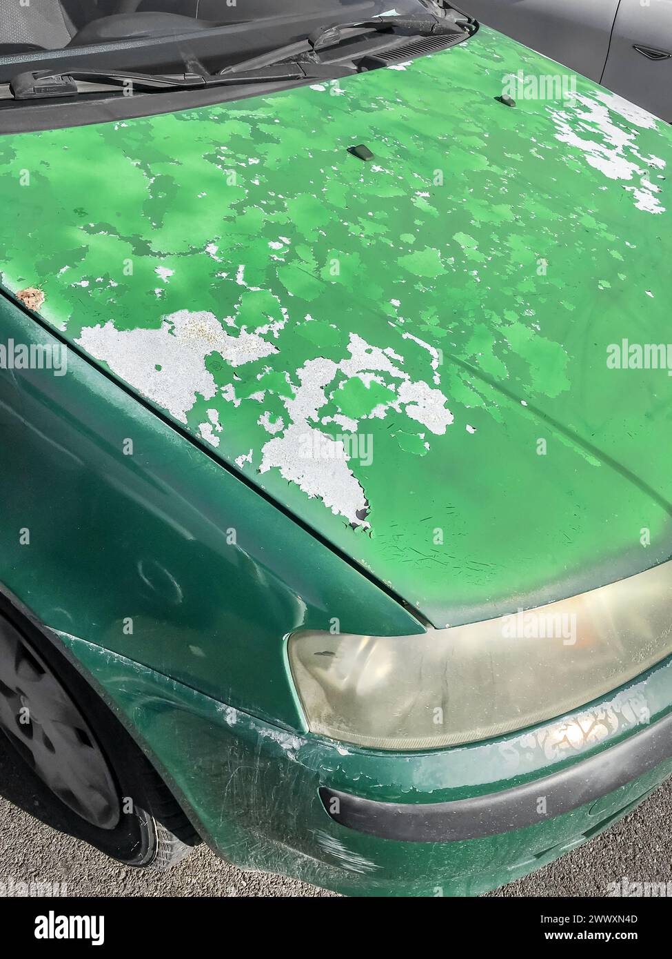 Cracked and peeling paint on an old car for background Stock Photo - Alamy
