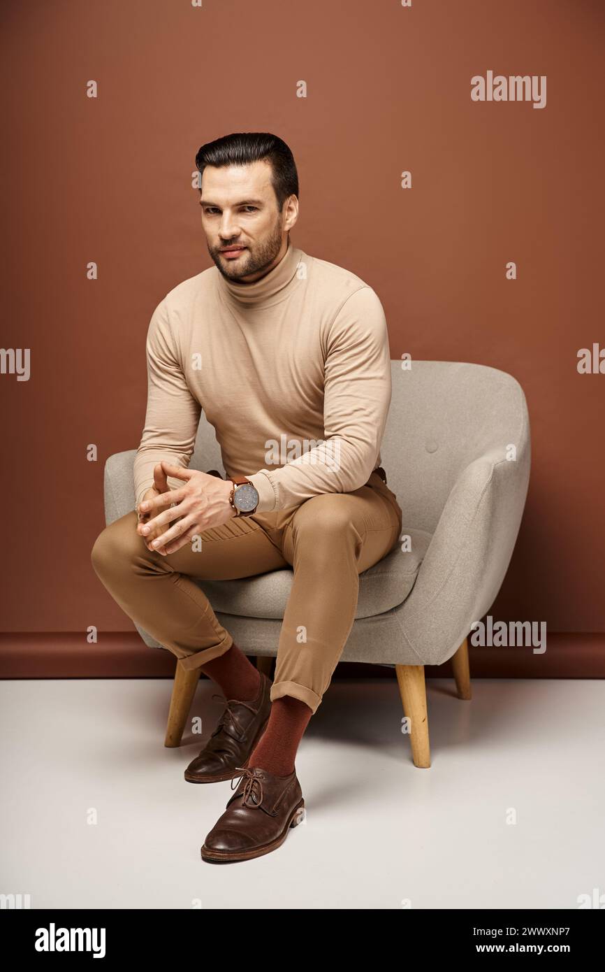handsome and sly man with bristle sitting on comfortable armchair on ...