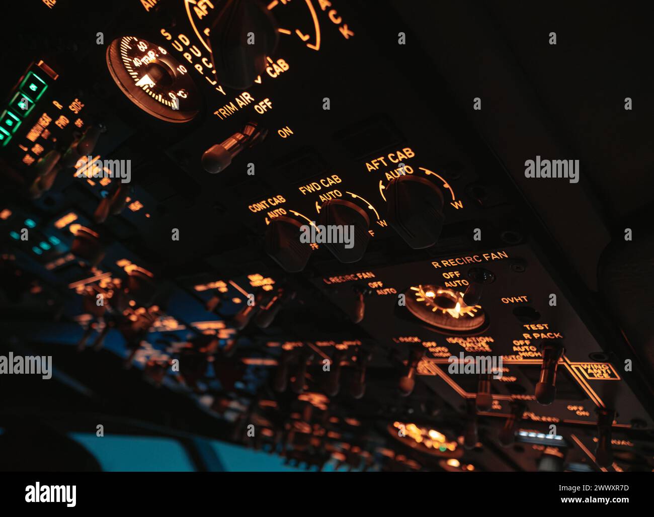 A close-up view of an aircrafts cockpit dashboard highlights an array ...