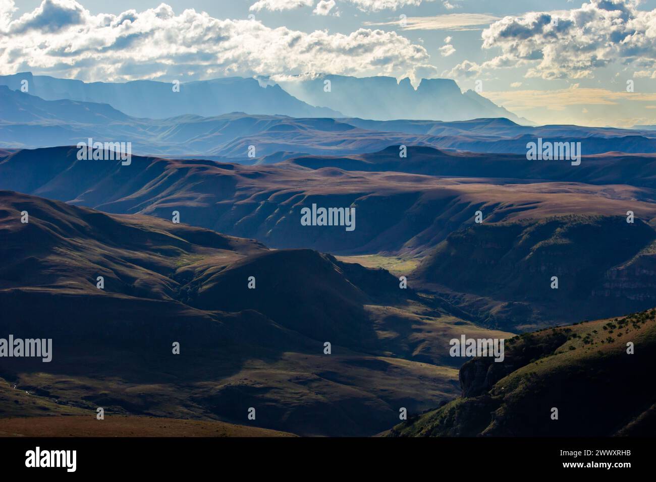Dramatic landscape of the cliffs, gorges and distant mountain peaks of ...