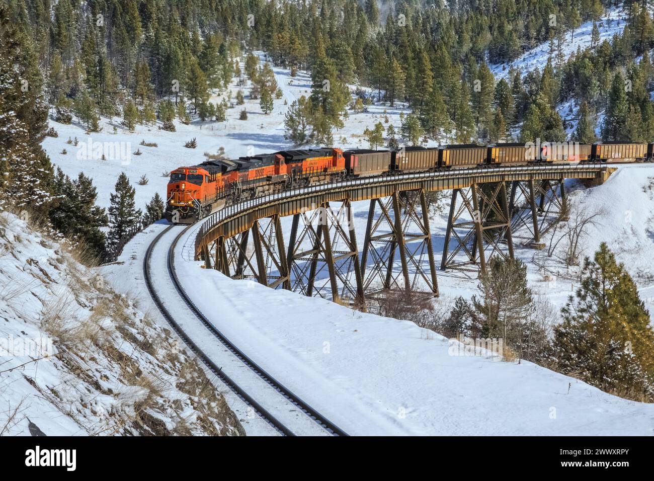 coal train on a trestle heading towards mullan pass on the continental ...