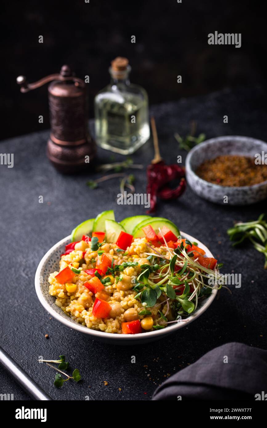 Bulgur with chickpeas and vegetables Stock Photo - Alamy