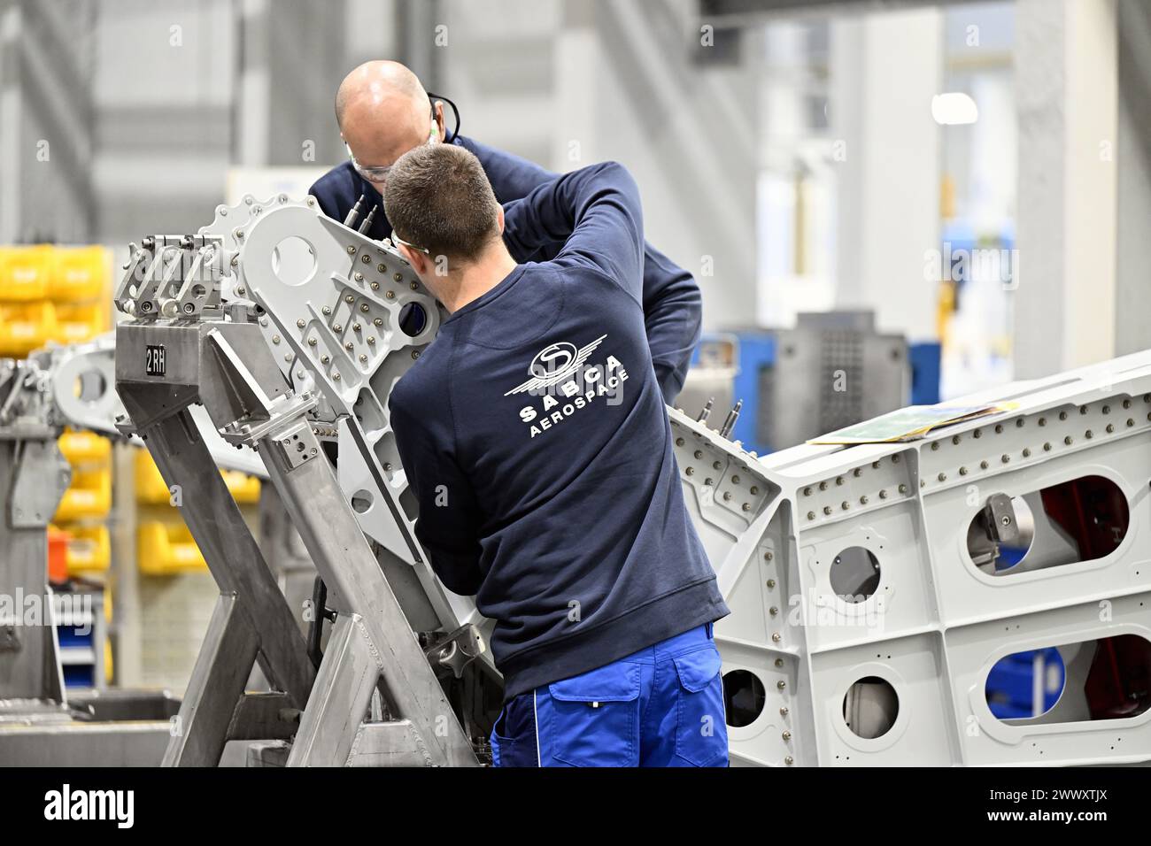 Workers pictured in action at a royal visit to the headquarters of ...