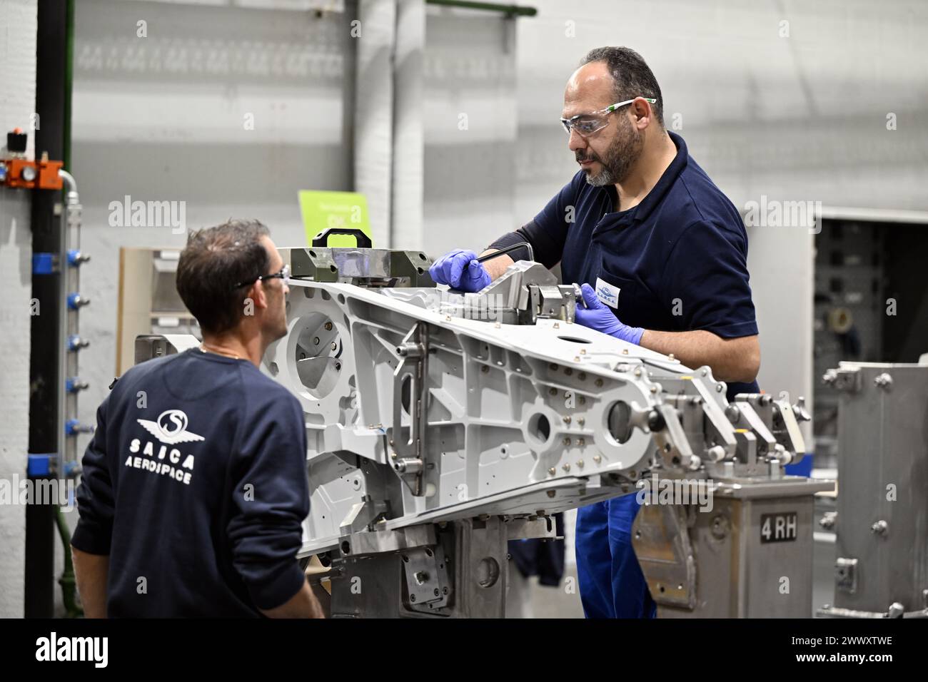 Brussels, Belgium. 26th Mar, 2024. Workers pictured in action at a ...