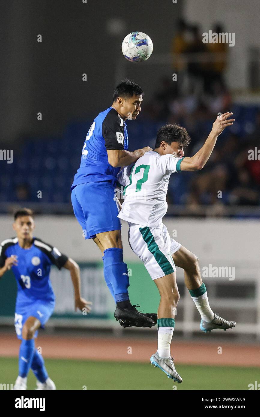 Manila, Philippines. 26th Mar, 2024. Ali Jasim Elaibi (R) of Iraq vies ...