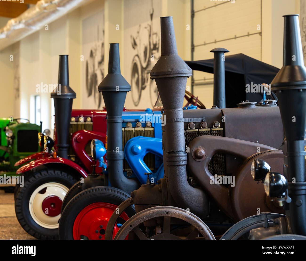 Vintage, colorful tractors in the museum. Agricultural machinery used ...