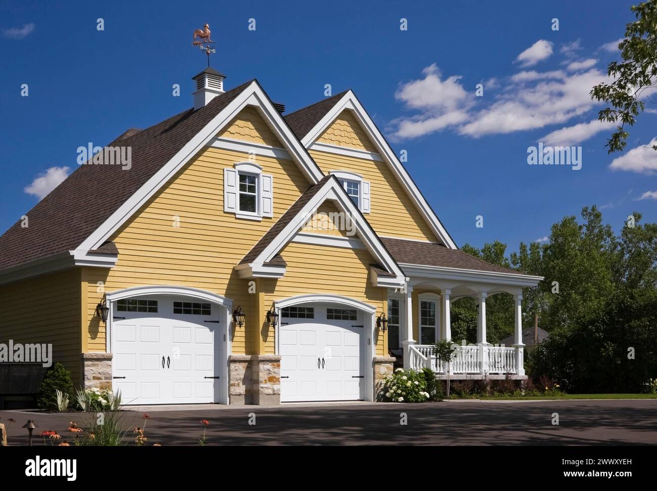 Yellow and white trim contemporary country house with two car garage ...