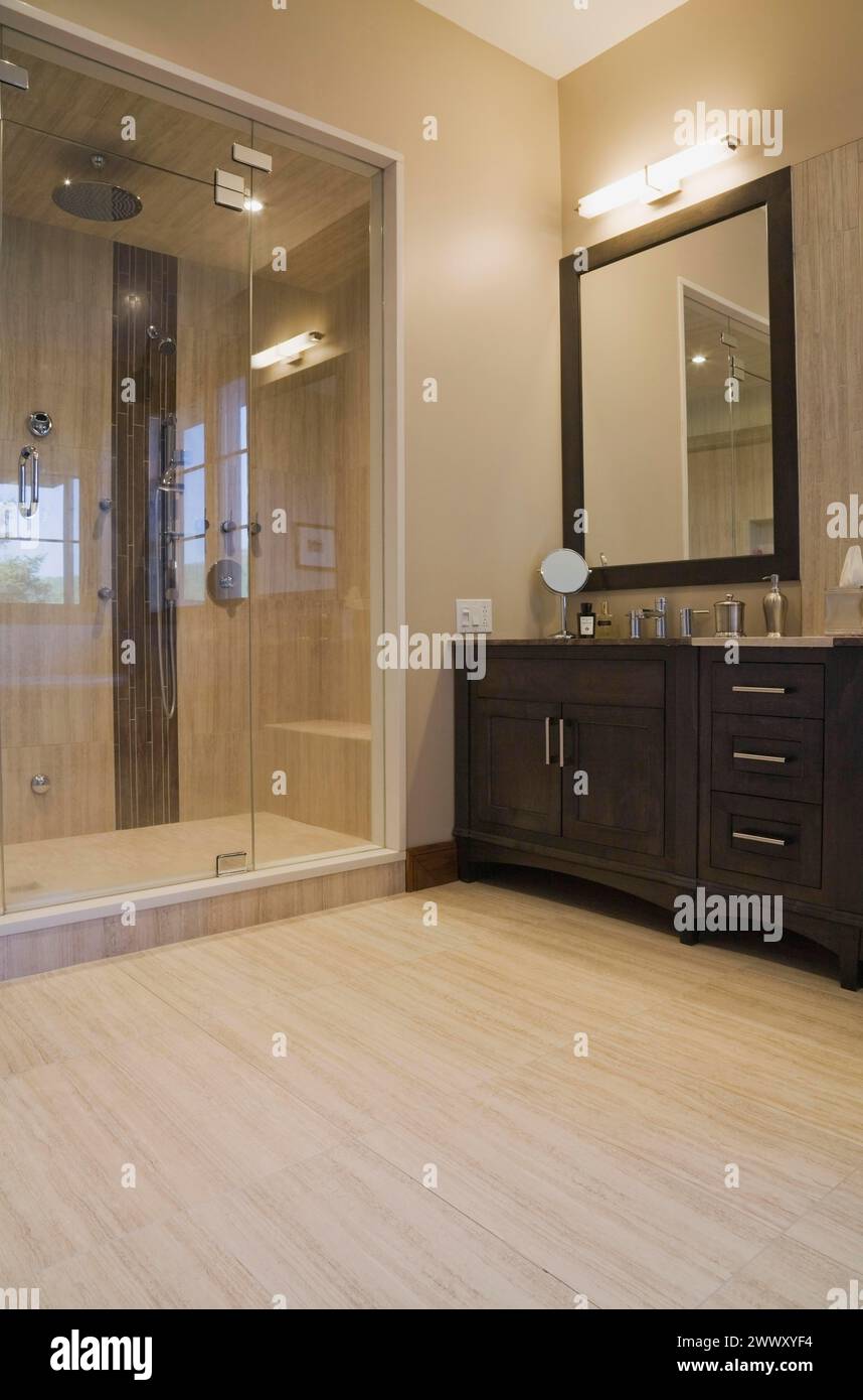 Main bathroom with double steam glass shower stall and vanity in ...