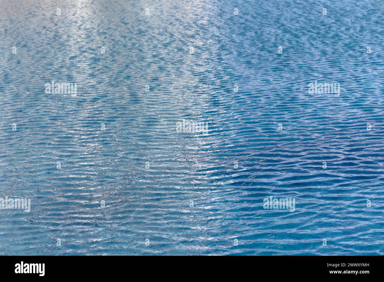 Beautiful sun reflections of water in the pool. Blue water. Background ...